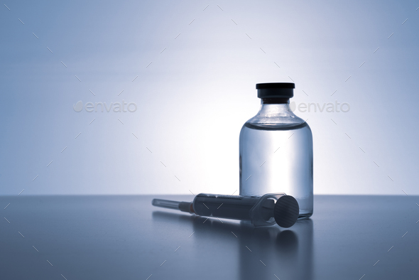 Bottle with solution for injection and injection needle Stock Photo by ...