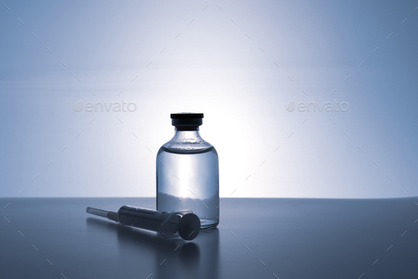 Bottle with solution for injection and injection needle Stock Photo by ...