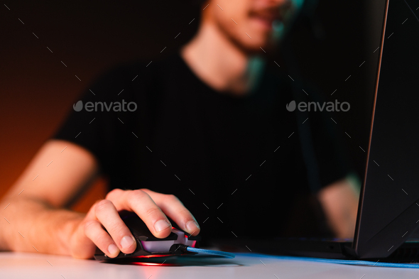 Human hand pressing computer mouse with flash of light on background ...