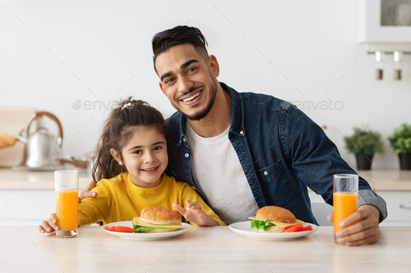 Lunch With Dad. Middle-Eastern Father And Little Daughter Eating ...