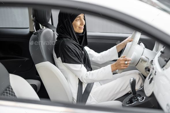 Muslim woman drives a car Stock Photo by RossHelen | PhotoDune