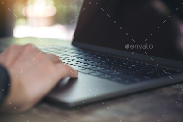 Closeup image of hands working and typing on laptop keyboard with blur ...
