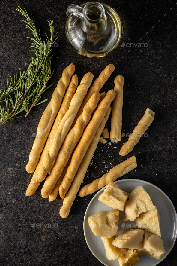 Grissini sticks and parmesan cheese. Traditional italian food. Stock ...