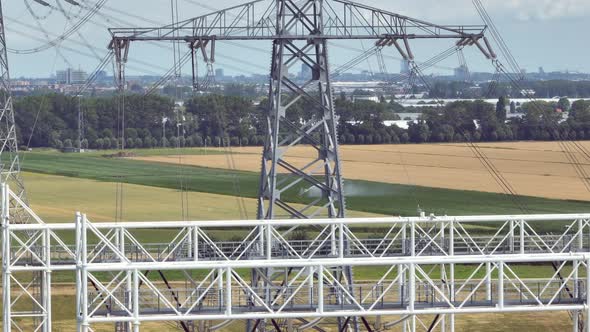 Pylons at a High Voltage Three Phase Electrical Substation, Stock Footage