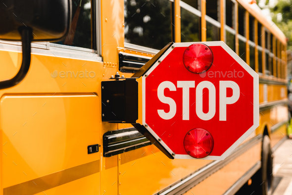Yellow school bus. Stop sign. Be careful, schoolchildren crossing the ...