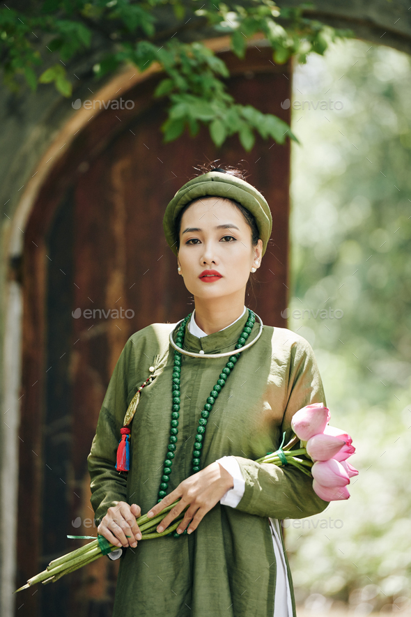 Vietnamese Woman with Lotus Flowers Stock Photo by DragonImages | PhotoDune