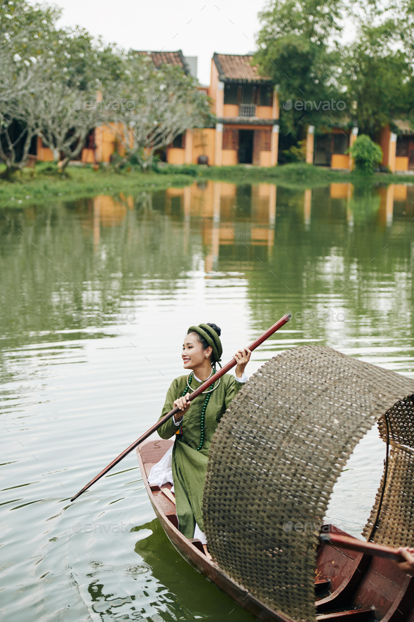 Vietnamese Woman Rowing Boat Stock Photo by DragonImages | PhotoDune