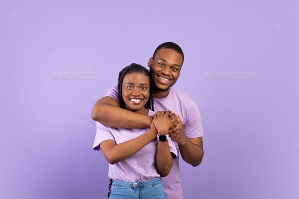 African American man hugging his woman at studio Stock Photo by ...