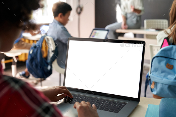African American school kid girl using laptop computer with white ...