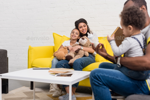 young parents spending time with kids at home Stock Photo by ...