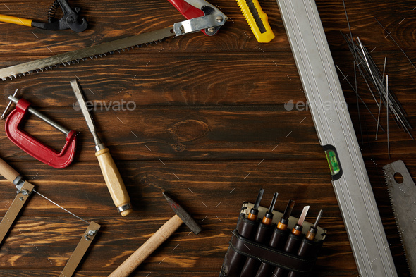 elevated view of different tools on brown wooden tabletop Stock Photo ...