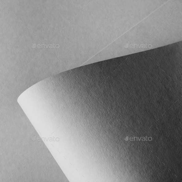close-up view of grey rolled paper sheet background Stock Photo by ...