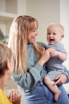 Two Children Jumping From Jetty Into Lake Stock Photo by monkeybusiness