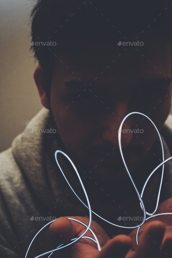 Mysterious and disturbed portrait of a young man in darkness Stock ...