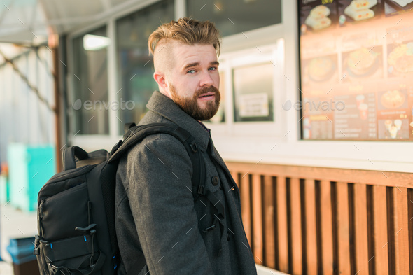 Portrait of man choosing fast food in food truck in the street. Meal ...