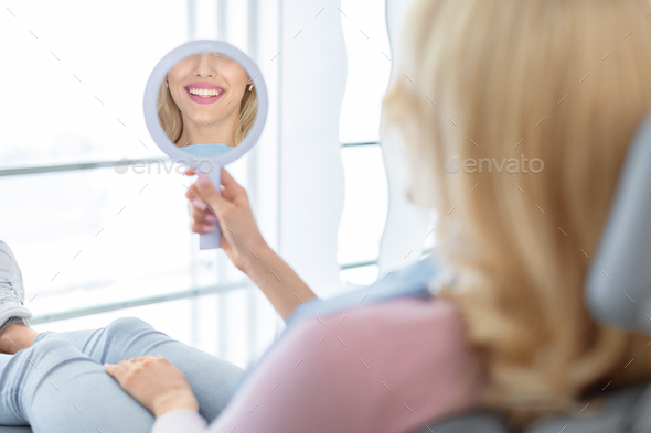 Beautiful healthy smile in dental mirror reflection Stock Photo by ...