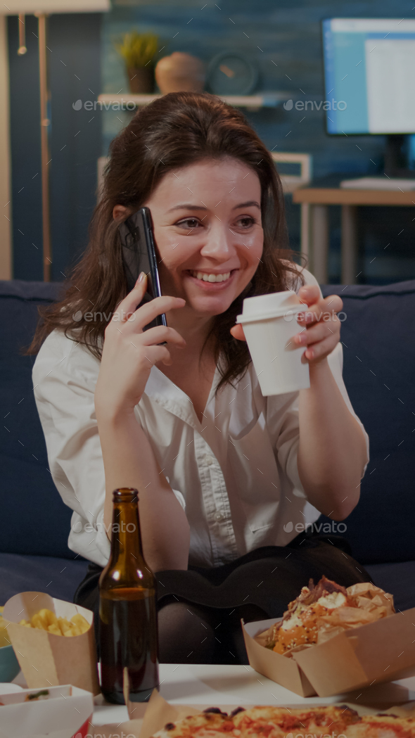 Caucasian adult enjoying phone call with friend in living room Stock ...