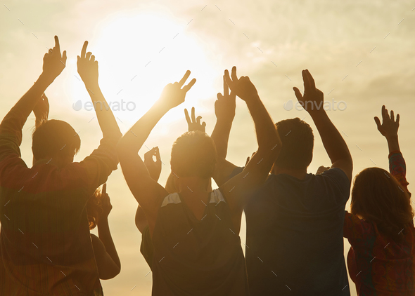 People celebrating victory, hands up. Stock Photo by stockfilmstudio