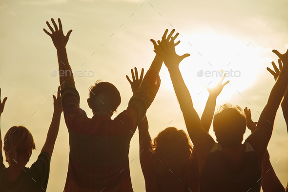 Back view people stretching hands up. Stock Photo by stockfilmstudio