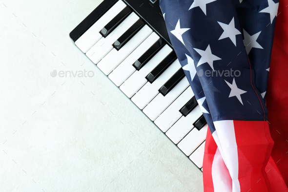 Midi keyboard and american flag on white textured background Stock ...