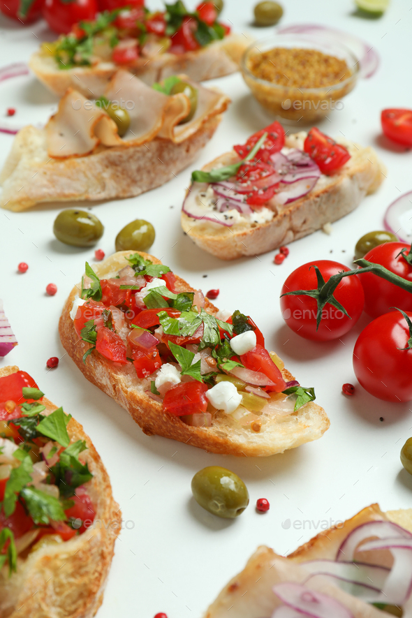 Delicious italian snacks bruschetta and ingredients on white background ...