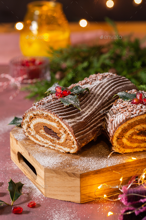 Traditional Christmas cake, chocolate Yule log with festive decorations ...