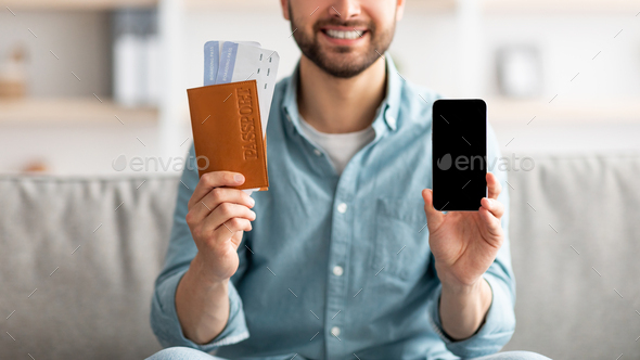 Online tour ot hotel booking app. Young guy with passport and tickets ...