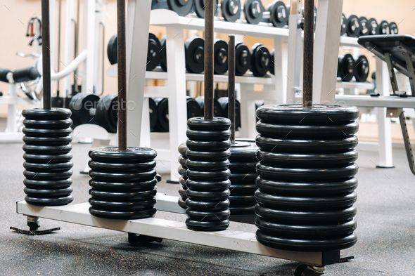 barbell discs stacked in rows in the gym Stock Photo by Lobachad ...