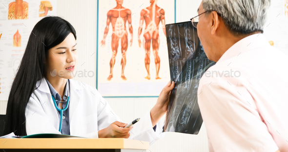 Doctor reporting diagnosis results to adult patient at hospital room ...