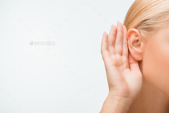 cropped view of blonde woman touching ear while listening isolated on ...