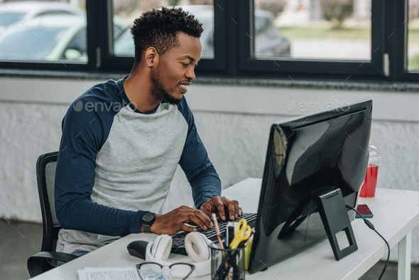 handsome african american programmer working on computer in office ...