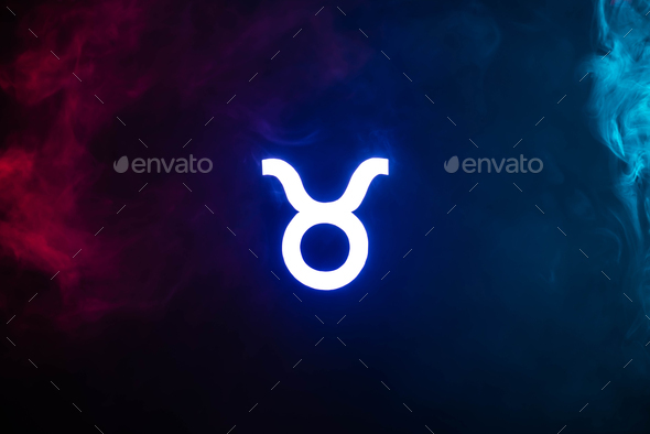 blue illuminated Taurus zodiac sign with colorful smoke on background ...
