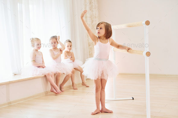 Practicing dance moves. Little ballerinas preparing for performance ...
