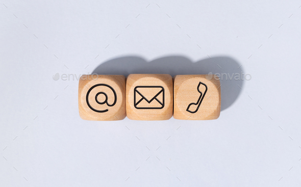 Contact us icons on wooden blocks Stock Photo by fotodestock | PhotoDune