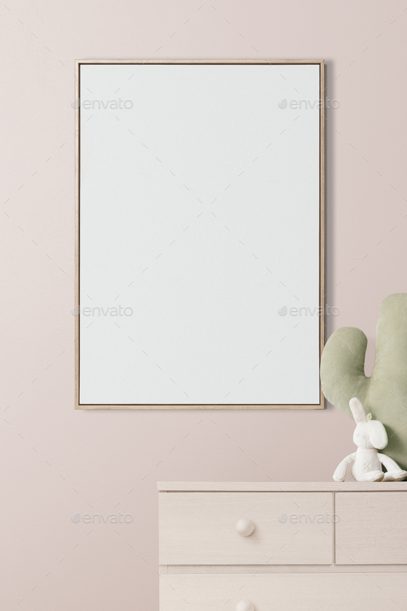 Blank picture frames hanging above a crib in a minimal nursery room ...