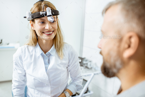 Female otolaryngologist with adult patient at the ENT office Stock ...