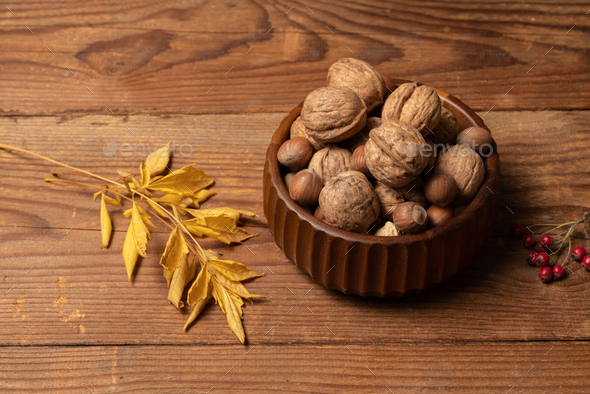 Nuts on solid wood table Stock Photo by Pasanheco | PhotoDune