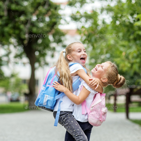 Two children hug and laugh. Square. The concept of school, study ...