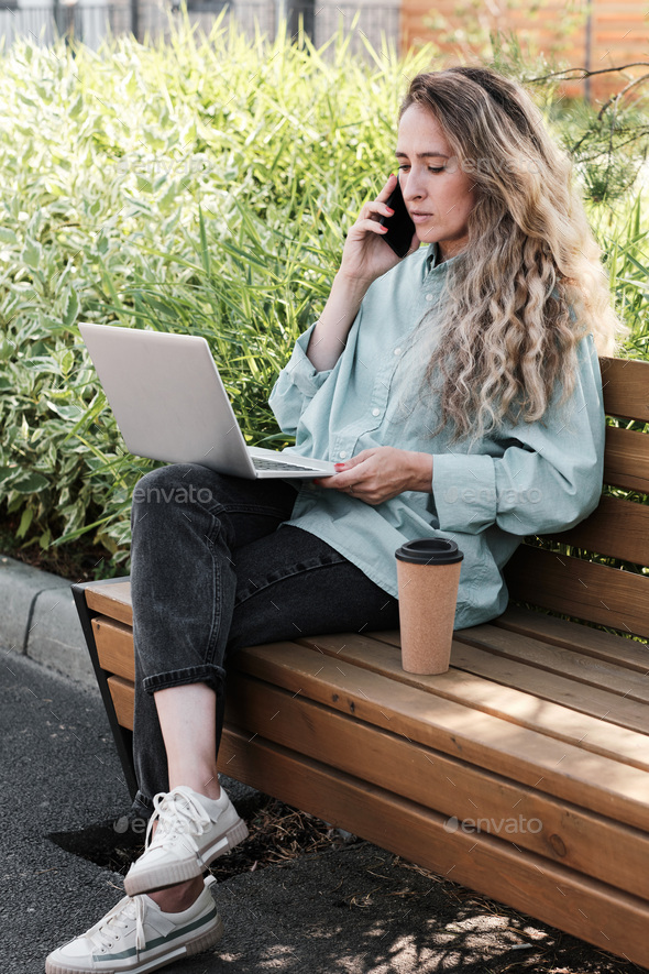 Modern Woman Working Outdoors Stock Photo by AnnaStills | PhotoDune