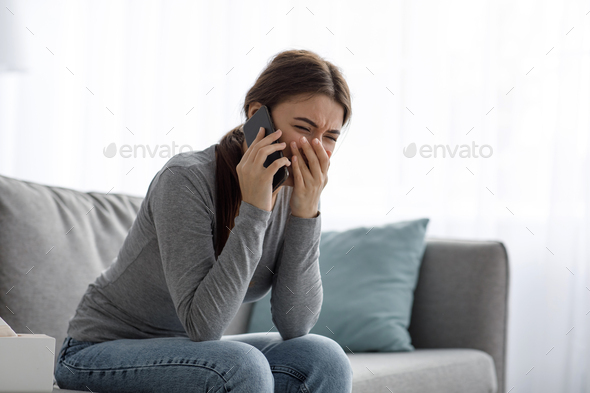 Sad despair cute millennial caucasian woman crying, have call and talk ...