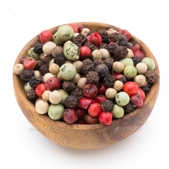 Pepper mix seed on spoon on white background. Stock Photo by GitaKulinica