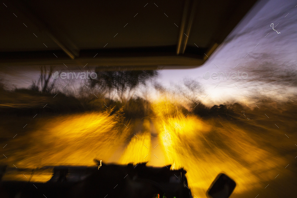 Vehicle with lights moving along a road after sunset. Stock Photo by ...