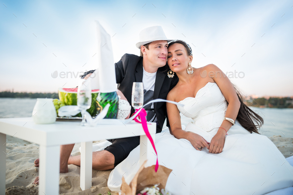 Side view of charming young couple bride and groom Stock Photo by ...