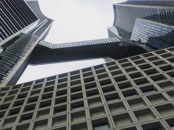 Bridge between two high-rise buildings Stock Photo by scopioimages