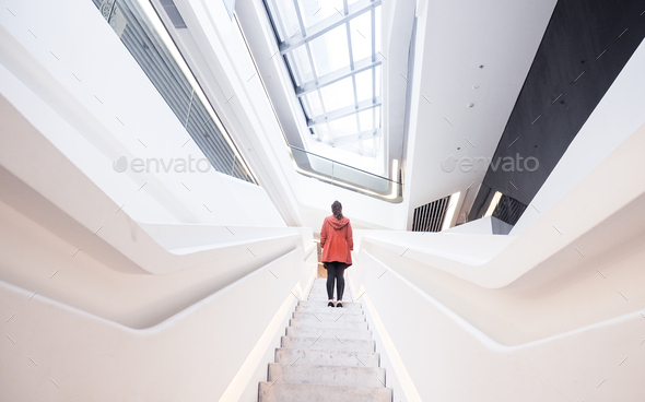 Person standing inside of a building Stock Photo by scopioimages ...