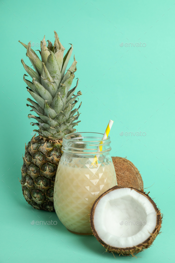Pina colada cocktail and ingredients on mint background Stock Photo by ...