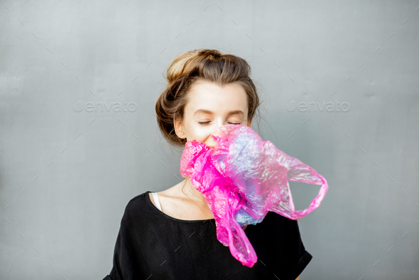 Conceptual portrait of a woman suffocating of plastic bags Stock Photo ...