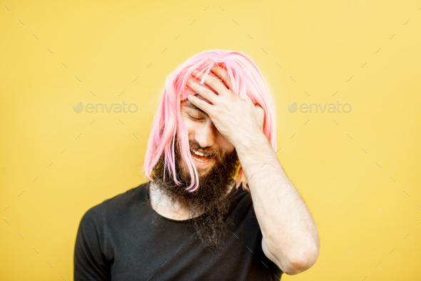 Man with color hair on the yellow background Stock Photo by RossHelen
