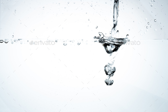 Jet of water forms small water vortex with funnel shape Stock Photo by ...