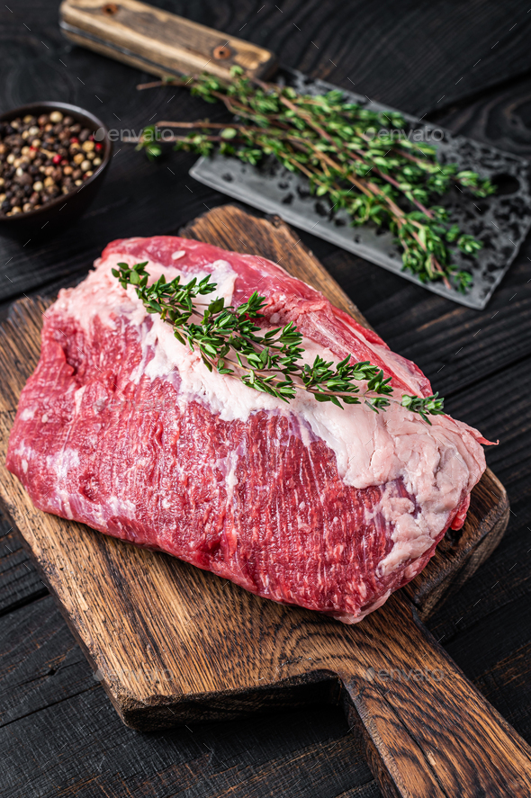 Fresh Raw Round roast beef meat cut on a butcher cutting board with ...
